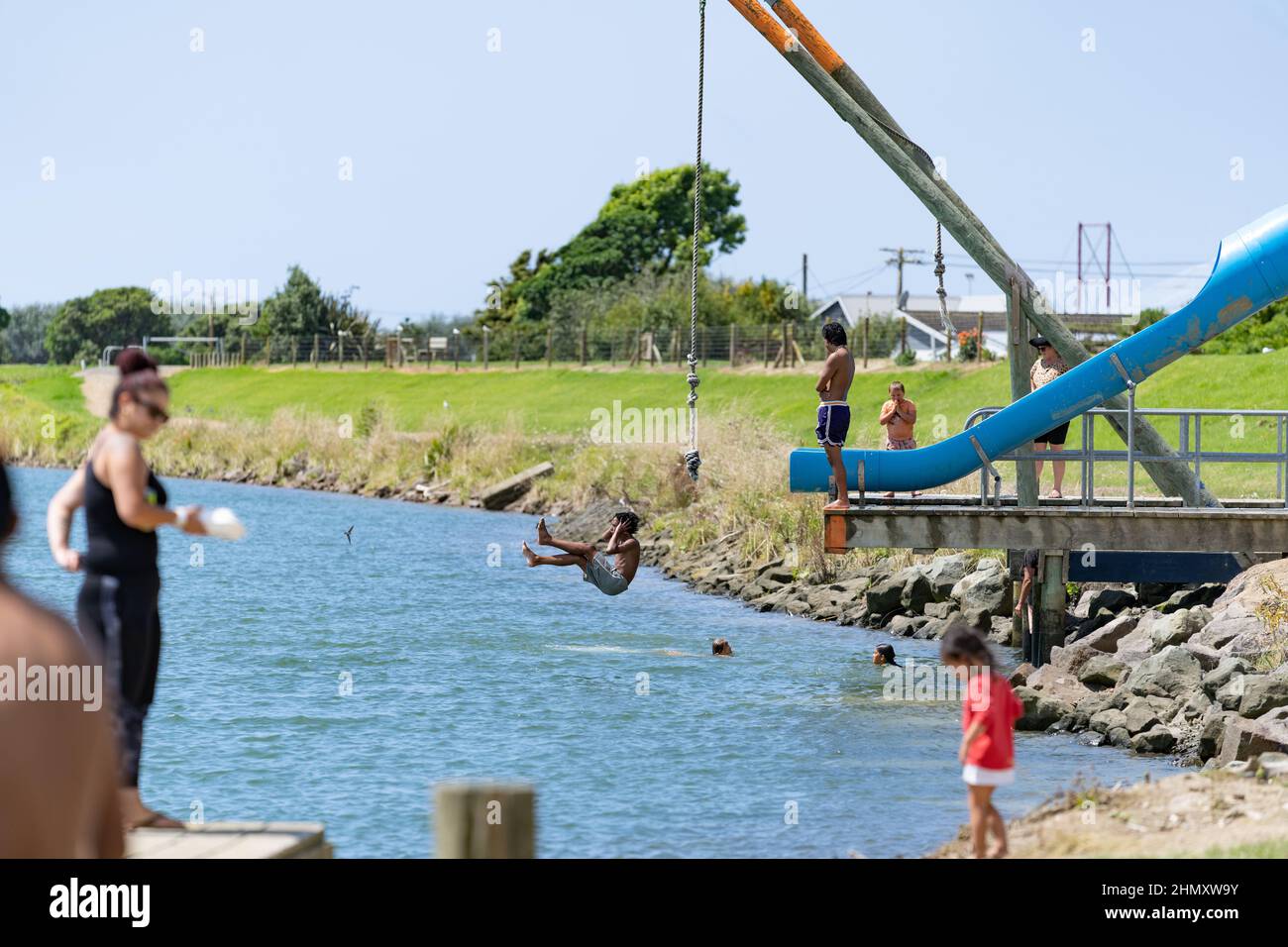Opotiki New Zealand - January 30 2022; Young people jumping into Otara ...