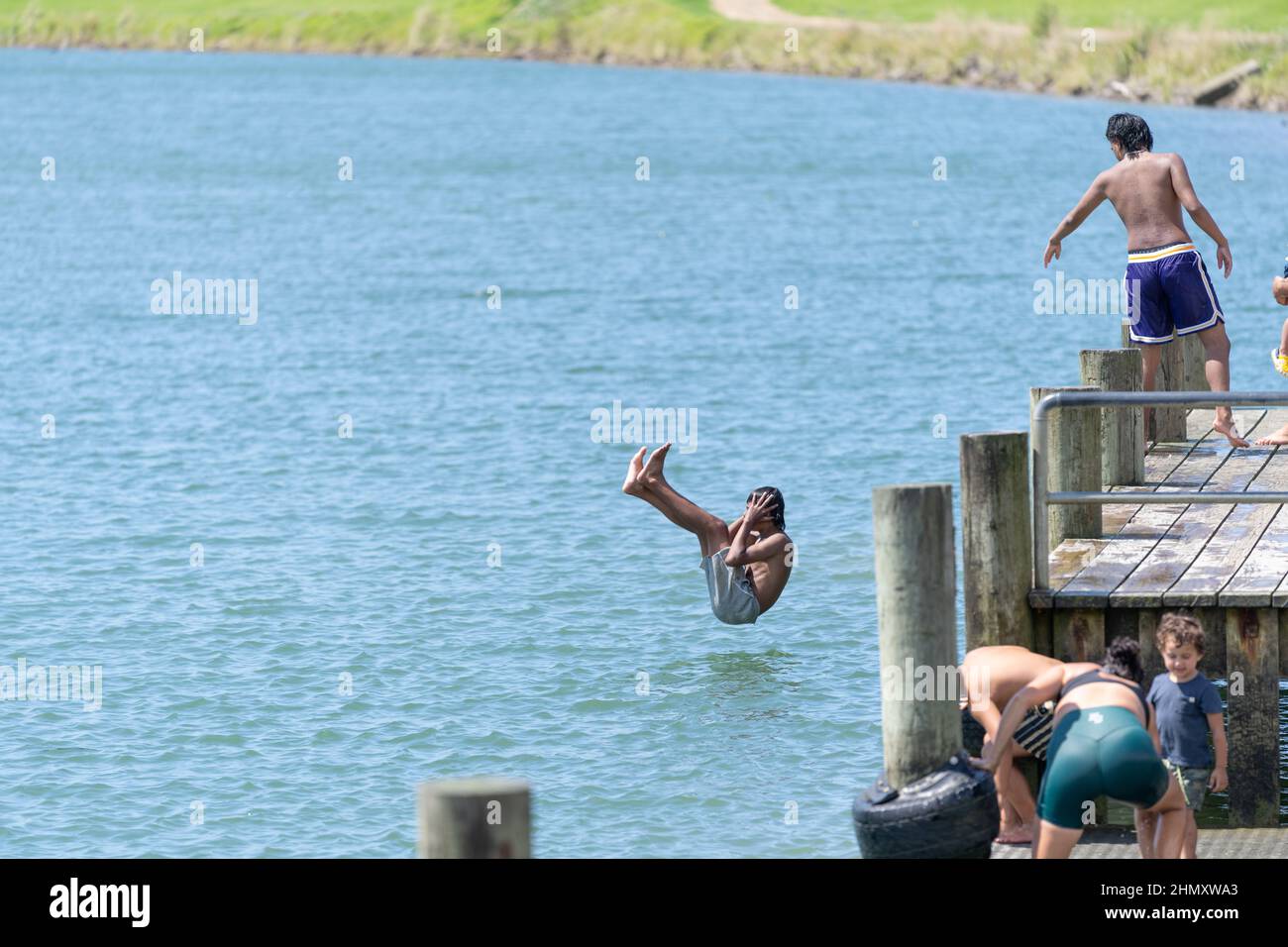 Opotiki New Zealand - january 30 2022; Young people jumping into Otara ...