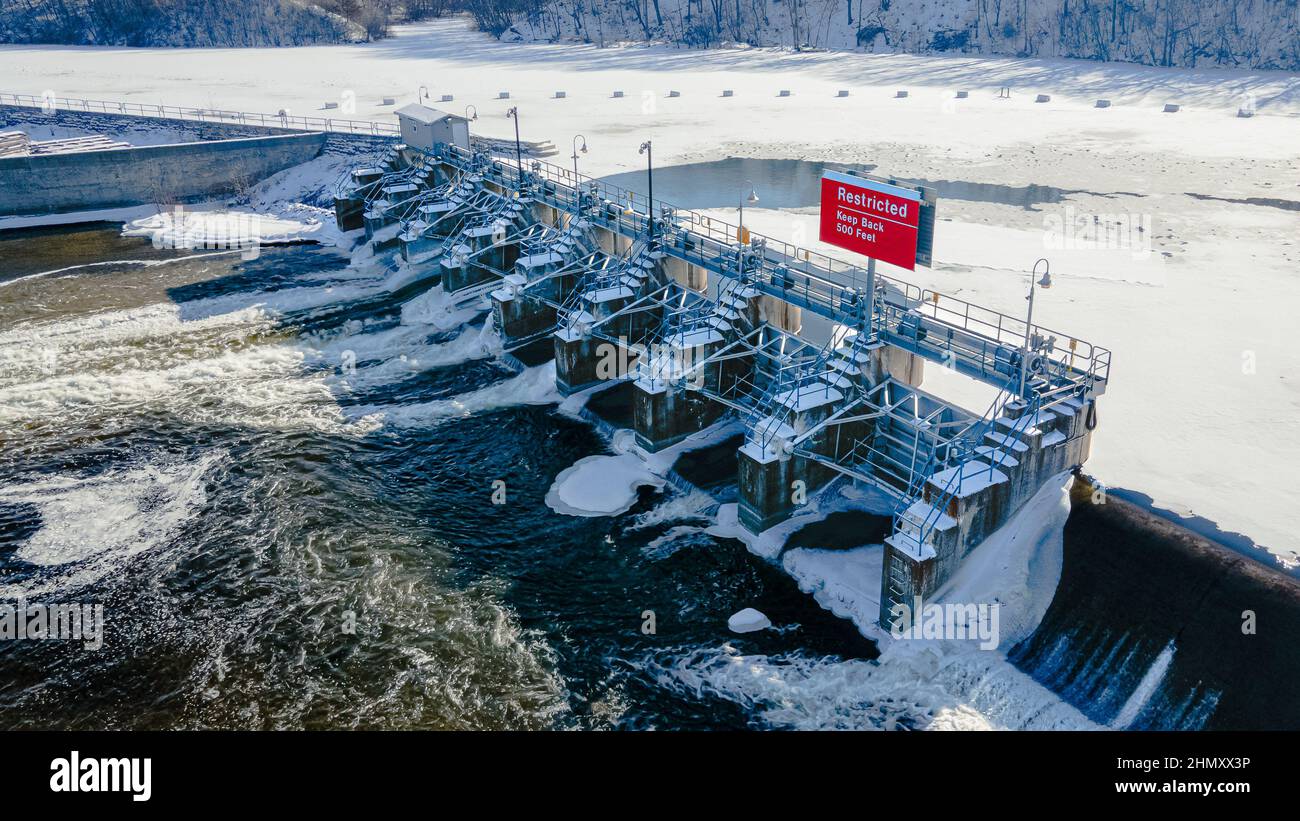 Ice and snow covers the lake surface as the dam is open with water ...