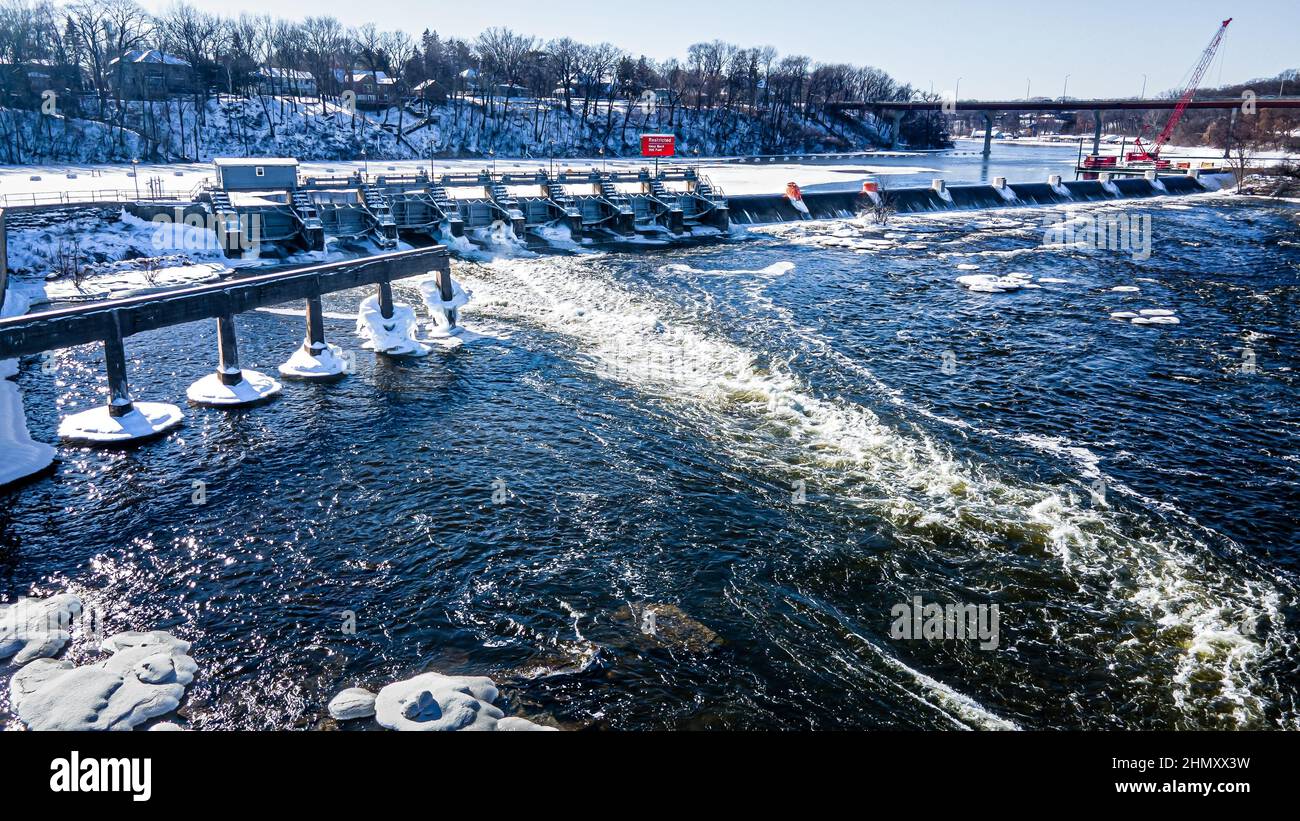 Ice and snow covers the lake surface as the dam is open with water ...