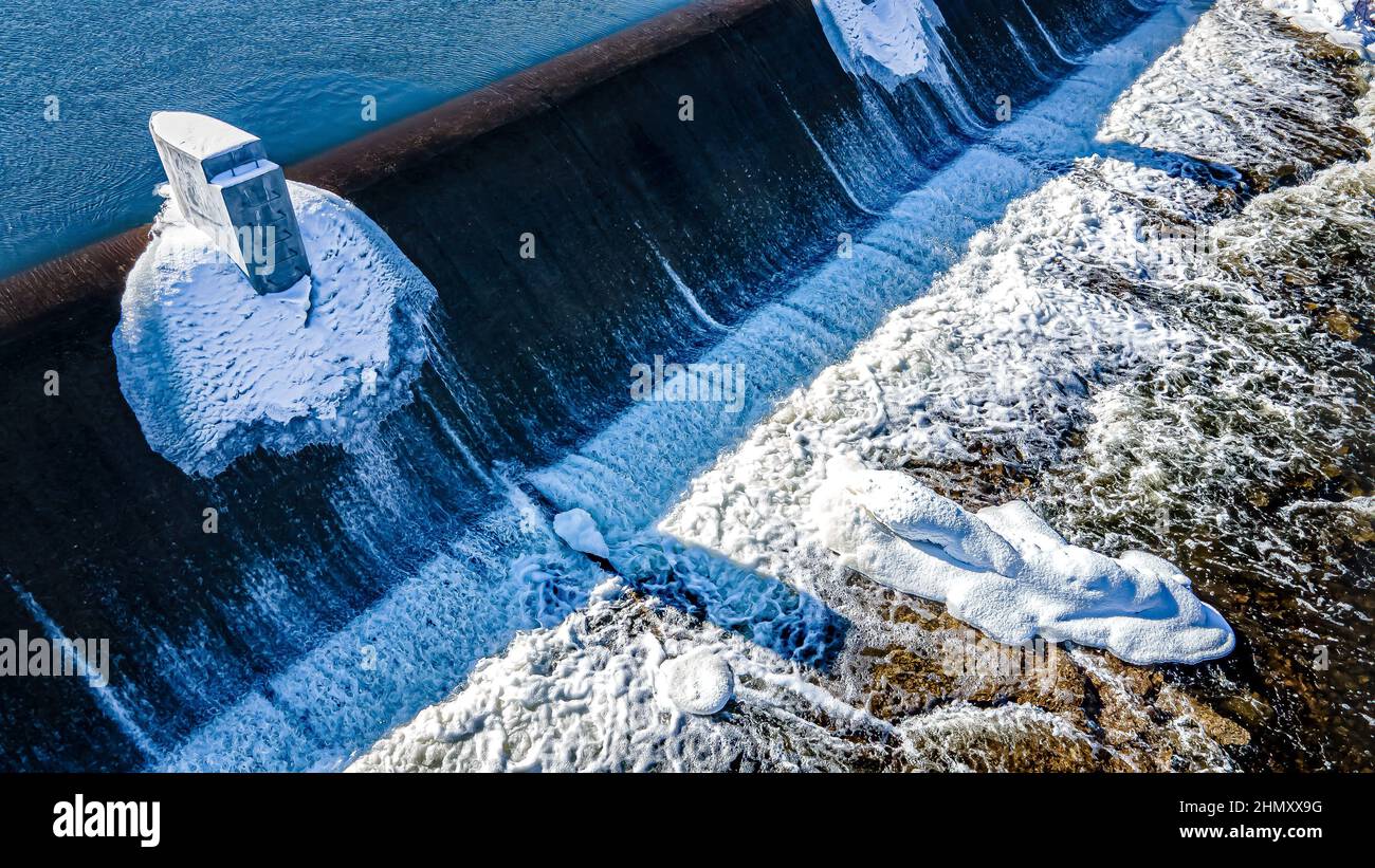 Ice has formed around the edges of the pillars in winter Stock Photo ...