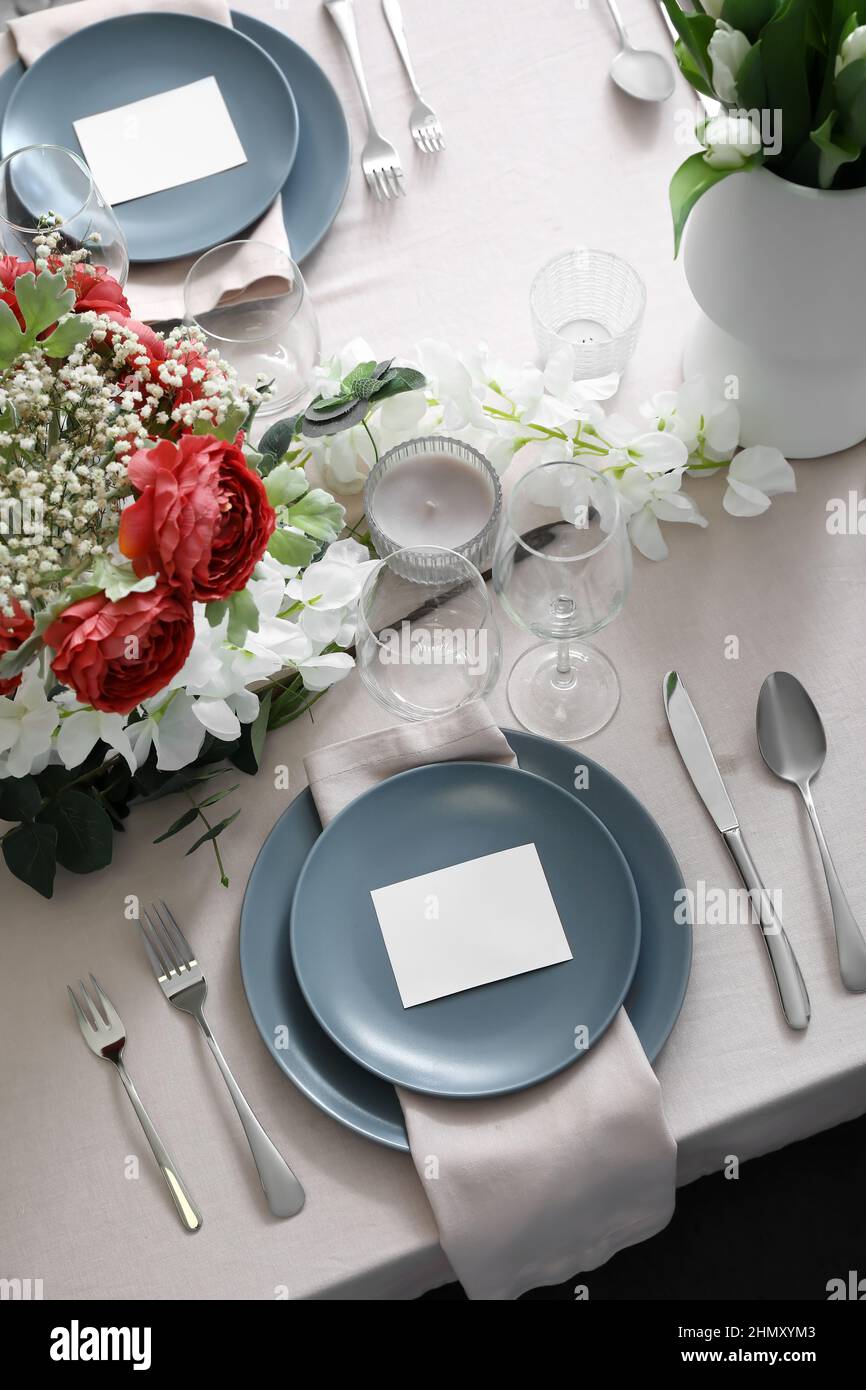 Stylish table setting with blank cards Stock Photo - Alamy
