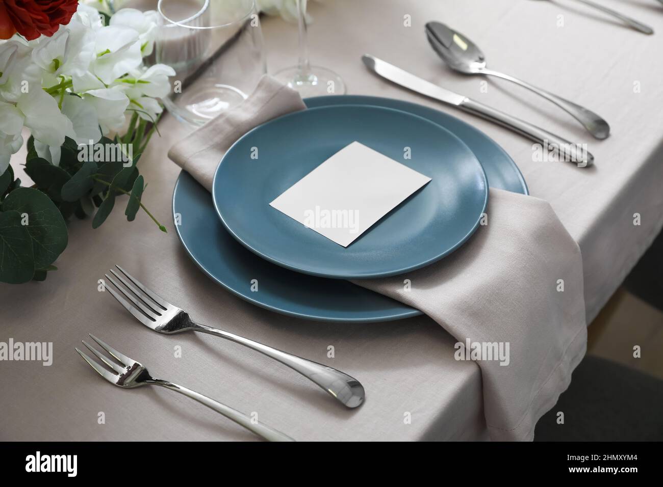 Stylish table setting with blank card Stock Photo - Alamy