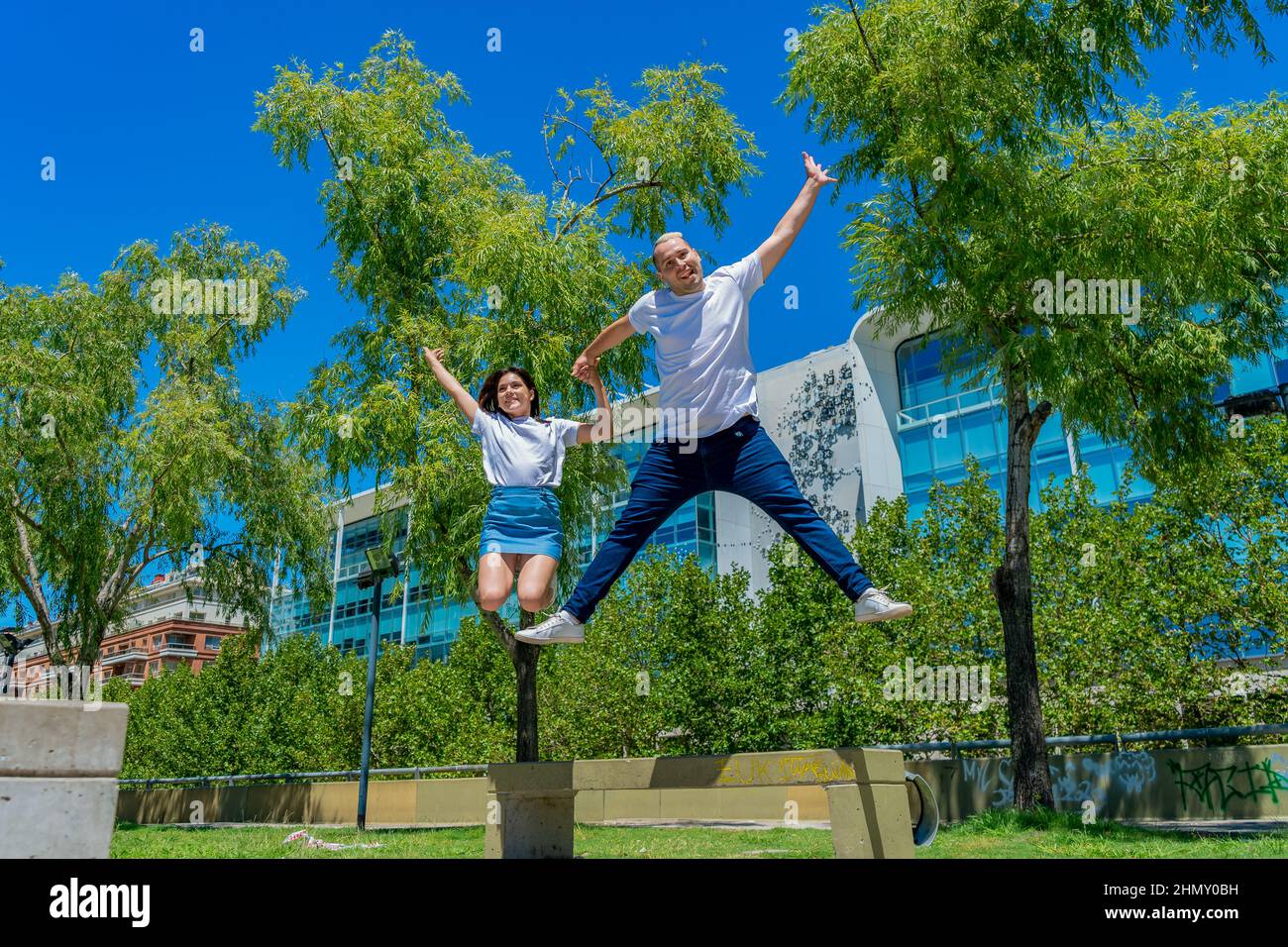 Young woman jumping happily hi-res stock photography and images - Alamy