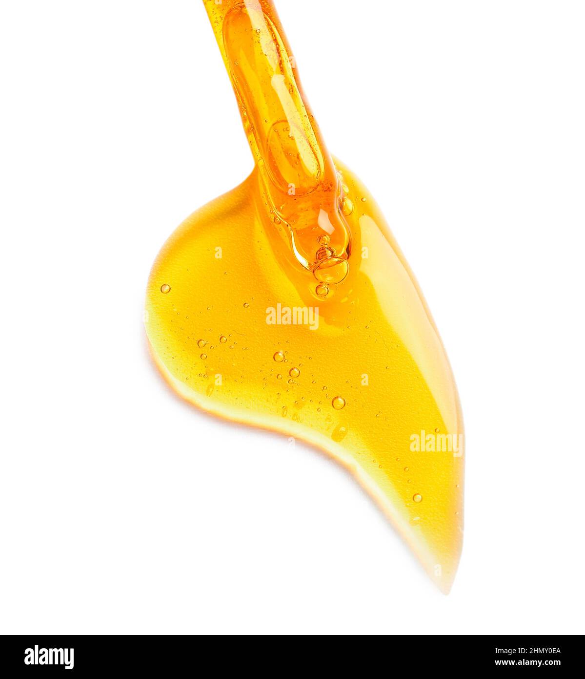 Glass dropper and sample of cosmetic serum on white background Stock ...