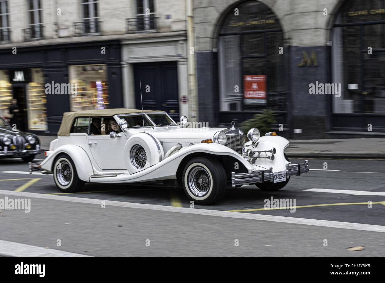 Photo of an old luxury custom car in the street, a Excalibur Phaeton IV ...