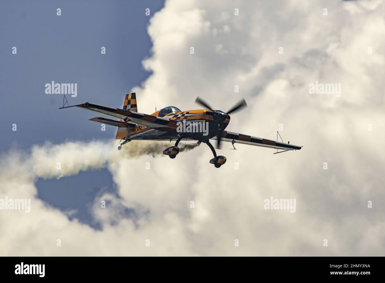 Photo of an acrobatic airplane show with white smoke, Extra 330sc Stock ...