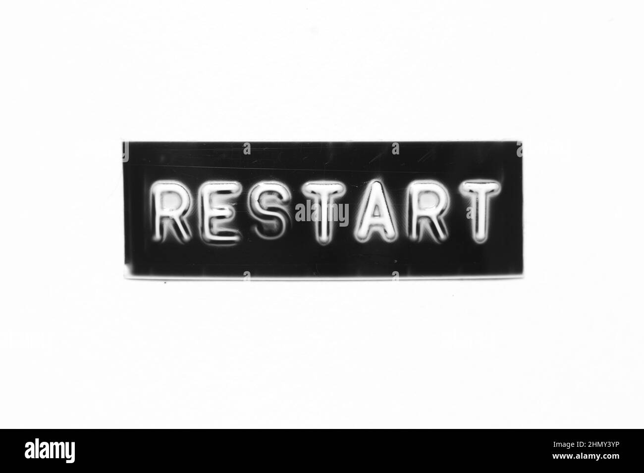 Black color banner that have embossed letter with word restart on white ...