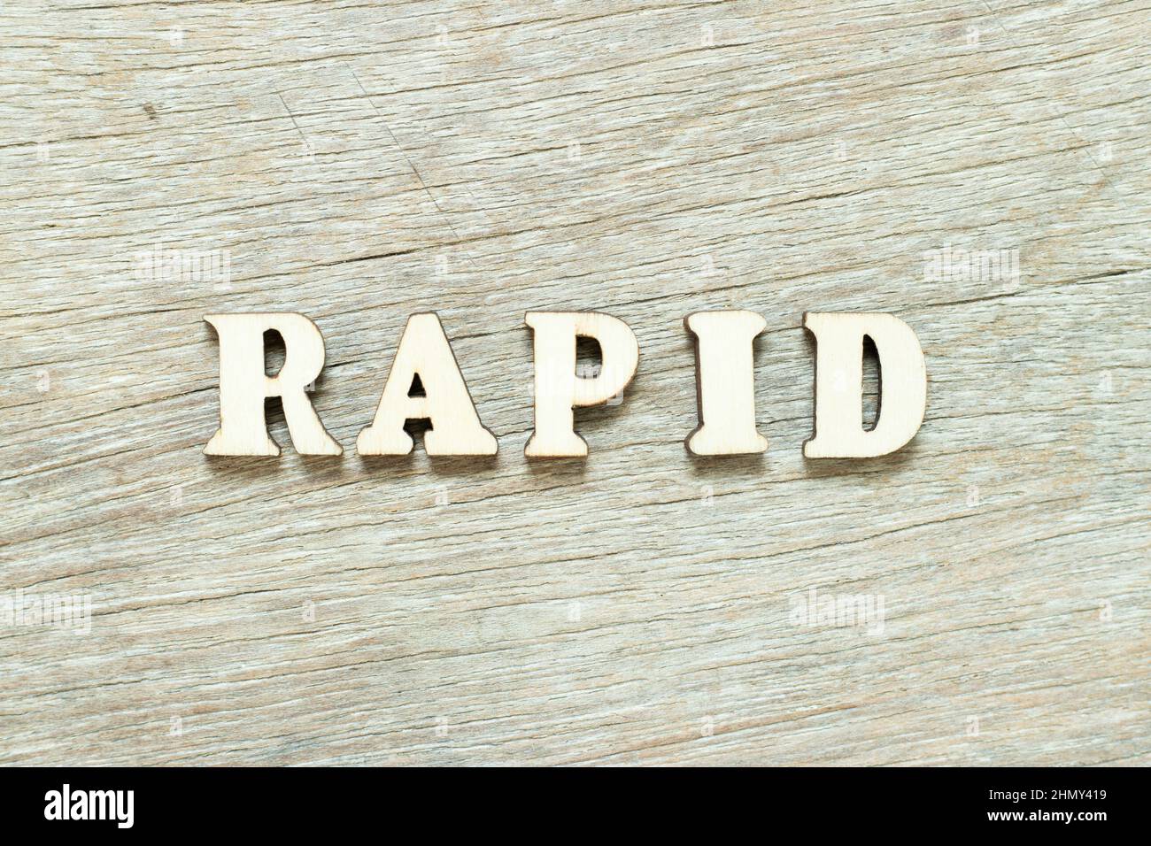 Alphabet letter in word rapid on wood background Stock Photo - Alamy