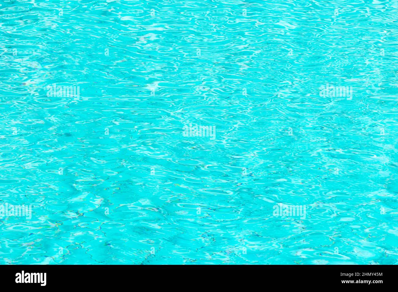 Ripple Water in swimming pool with blue tile floor background Stock ...