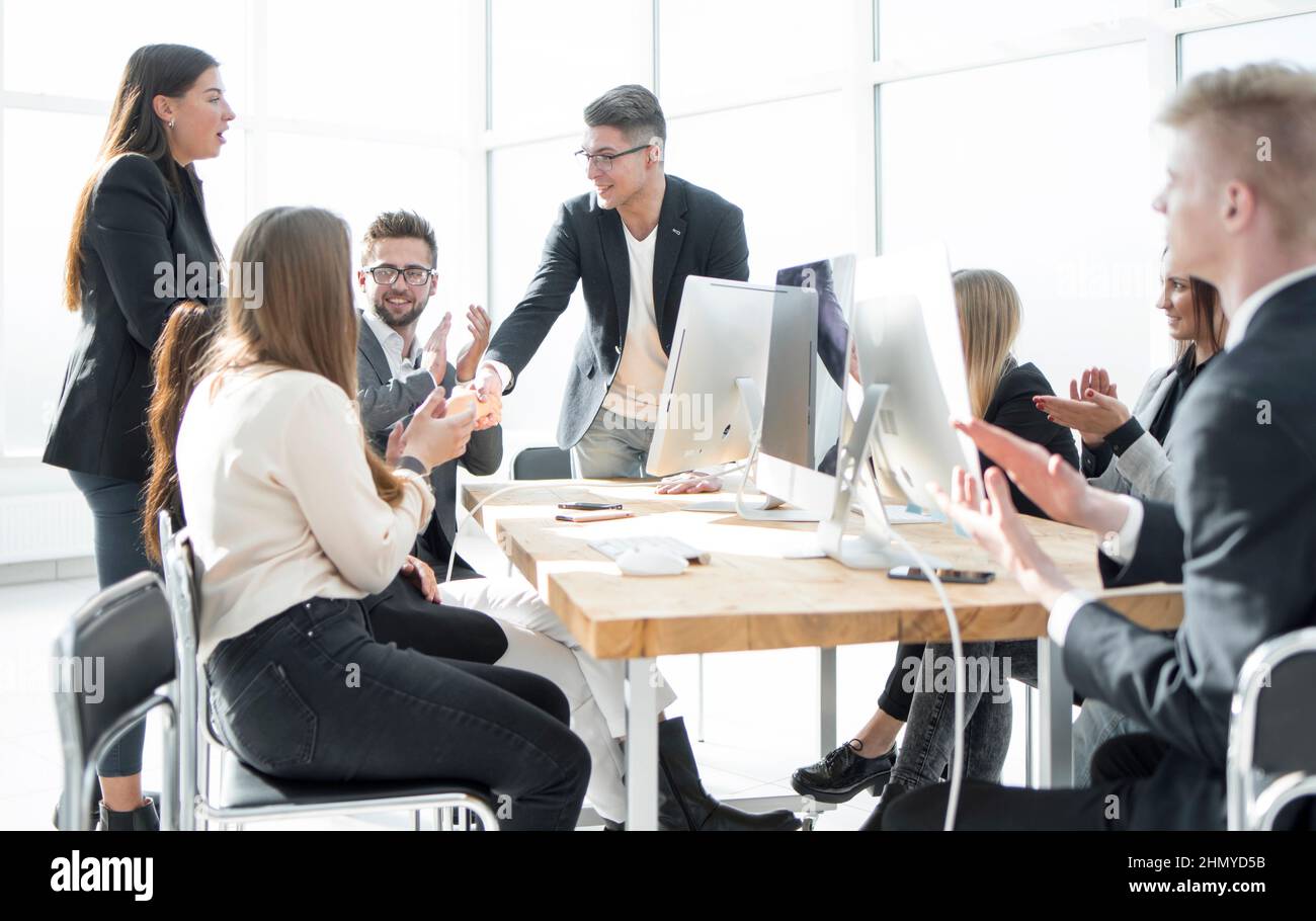 boss shaking hands with an employee at an office meeting Stock Photo ...