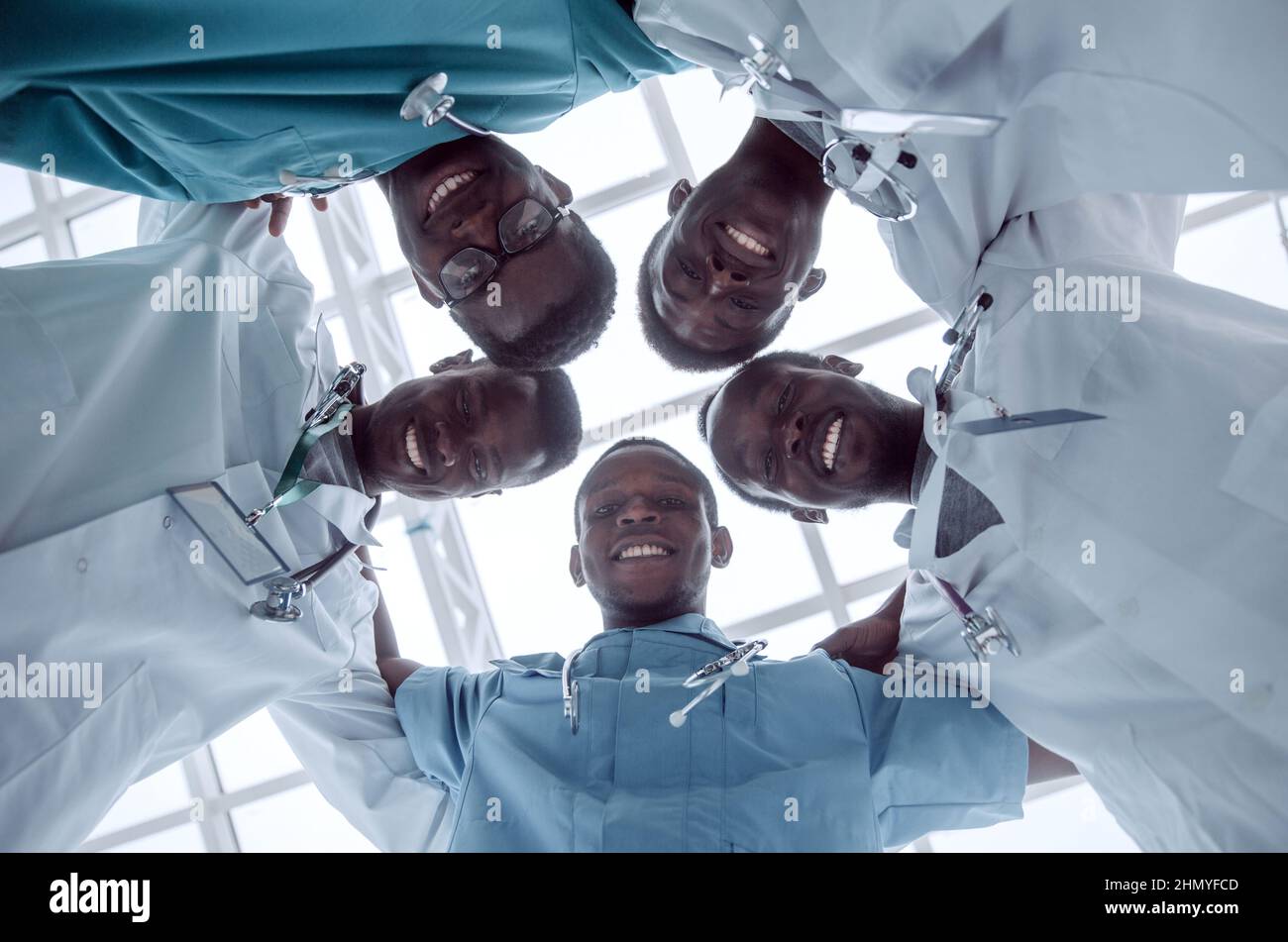bottom view. group of young doctors standing in a circle Stock Photo ...