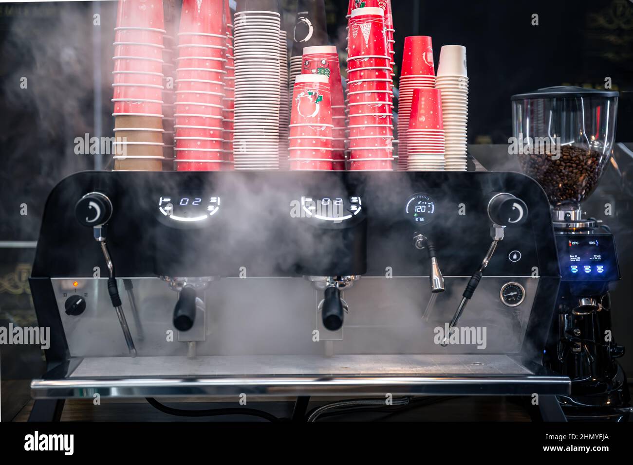 Steam from a coffee machine, a professional coffee machine in a coffee ...