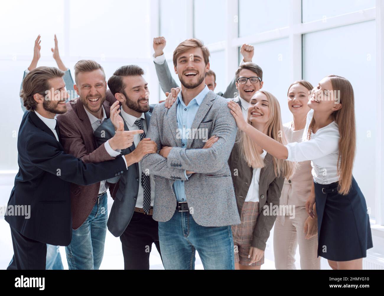 happy business team congratulating their leader . success concept Stock ...