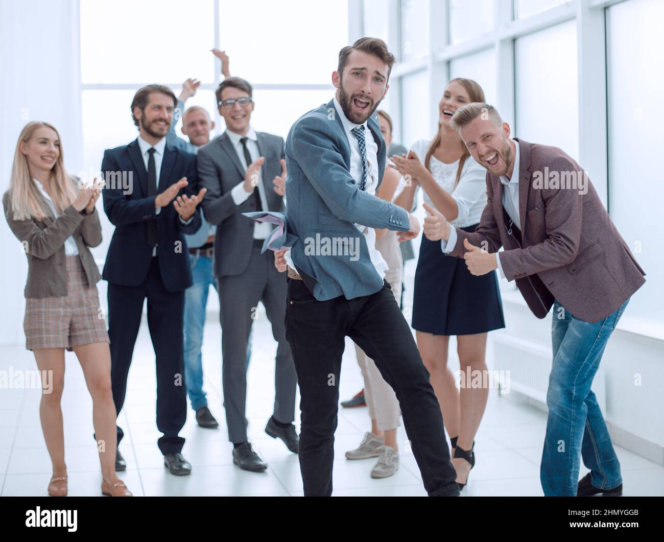 jubilant group of employees meeting the boss of the winner Stock Photo ...