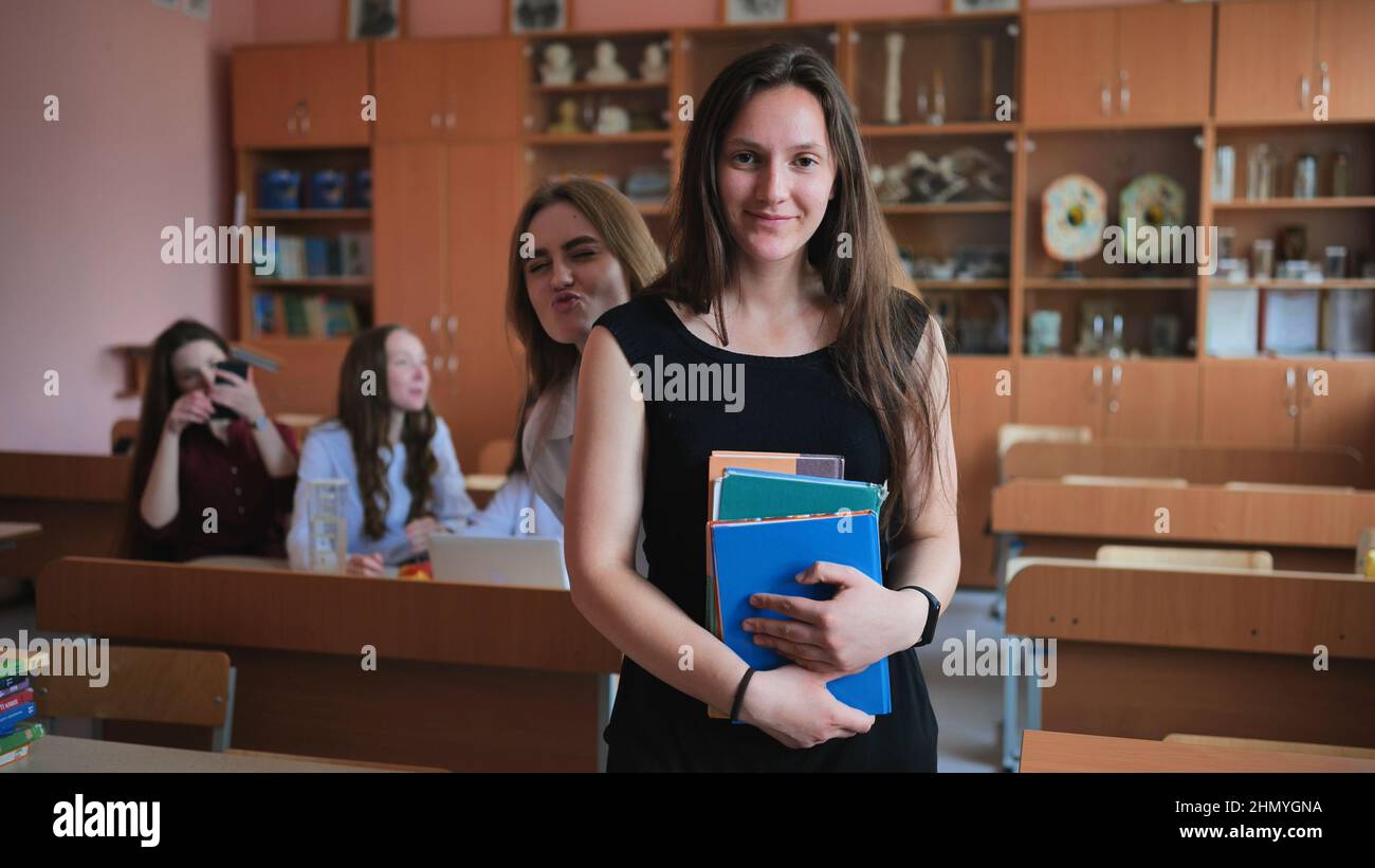 Beautiful female students are posing in the class Stock Photo - Alamy