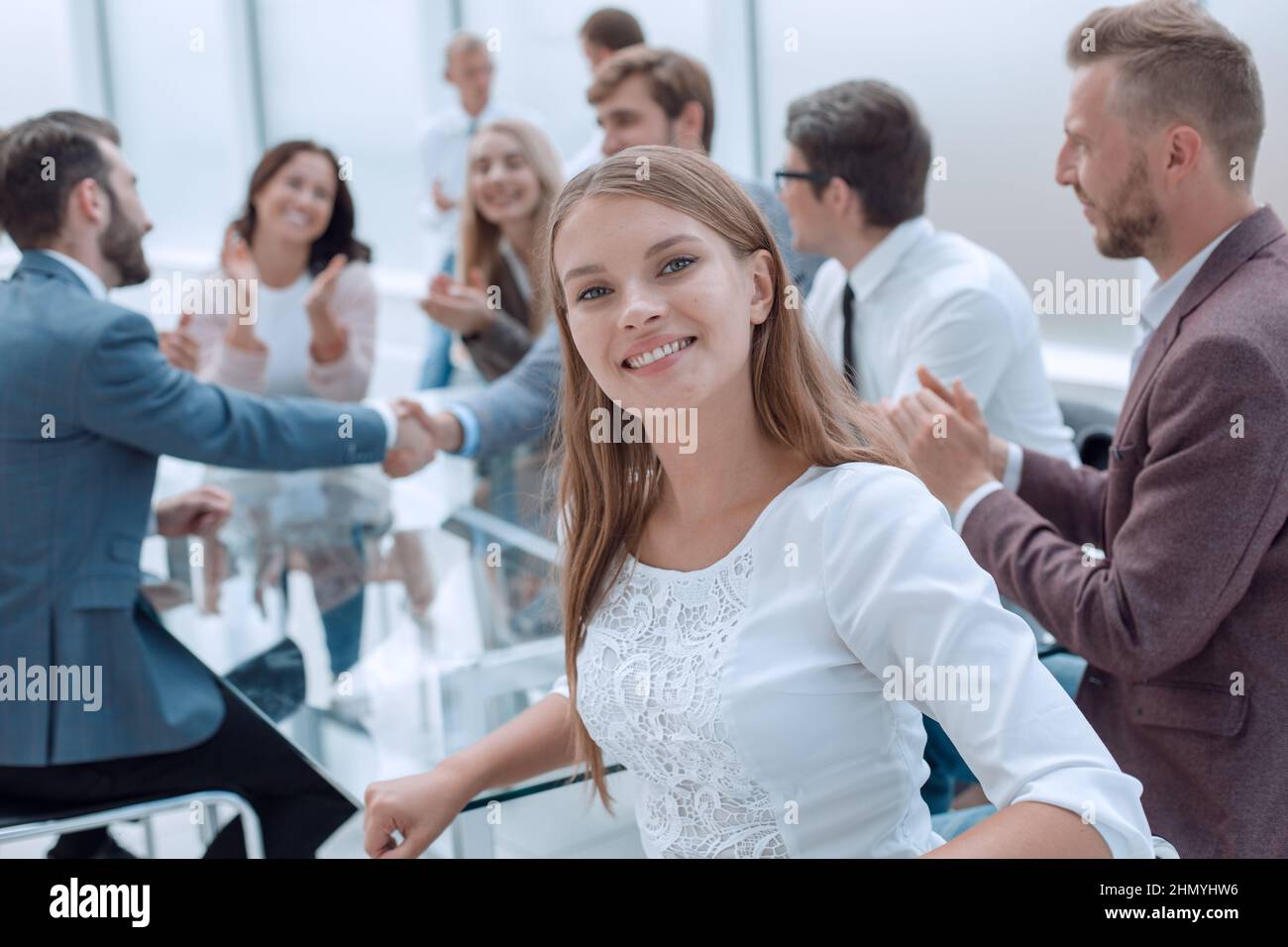 young company employee standing in business office Stock Photo - Alamy