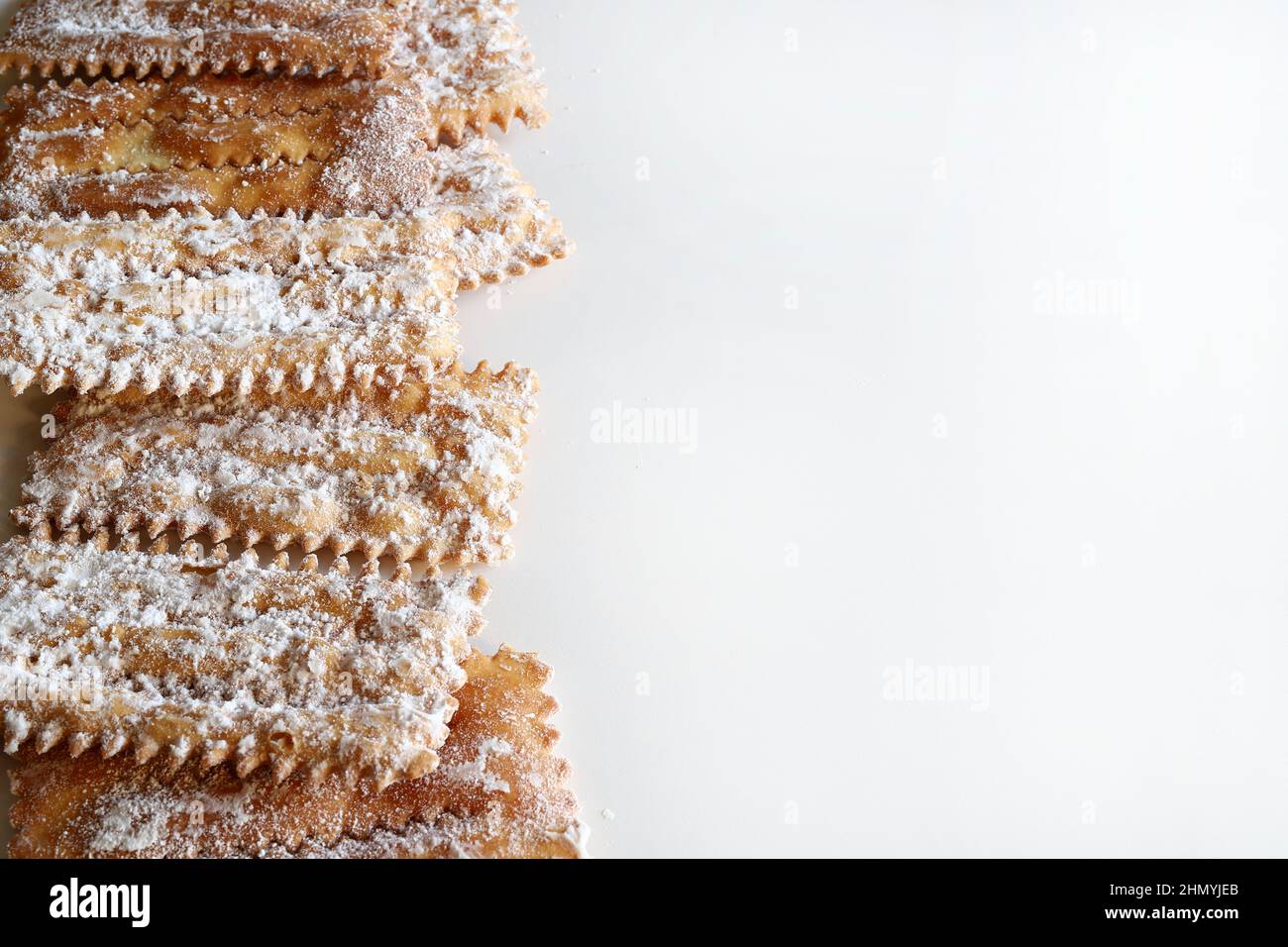Homemade traditional Italian carnival sweets: chiacchiere on white ...