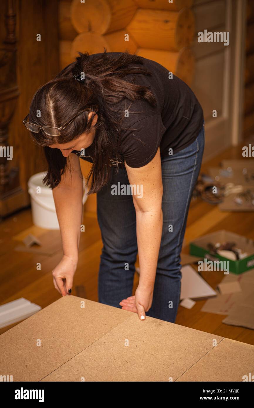 Handyman fixing wardrobe hi-res stock photography and images - Alamy