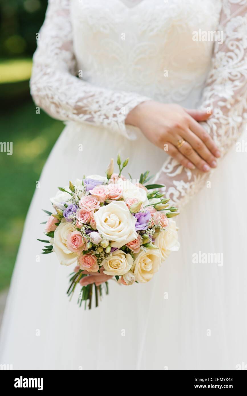Beautiful wedding colorful bouquet in the hands of the bride. Wedding ...