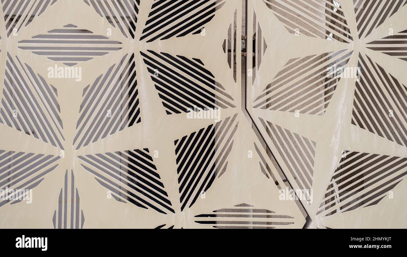 Metal qatari or arabic star pattern on the wall of metro station in ...