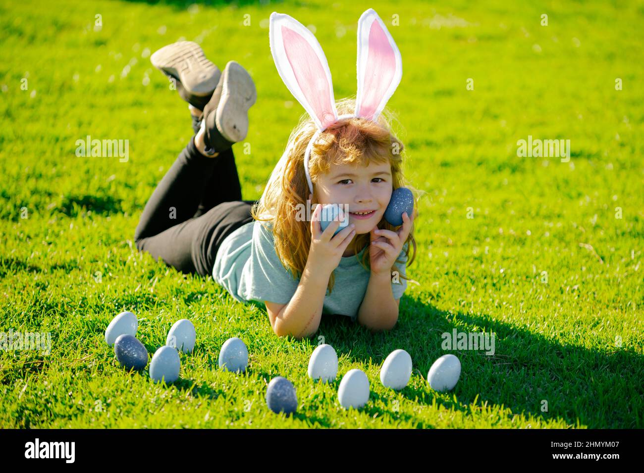 Child boy hunting easter eggs. Cute kid having fun in park. Easter egg ...