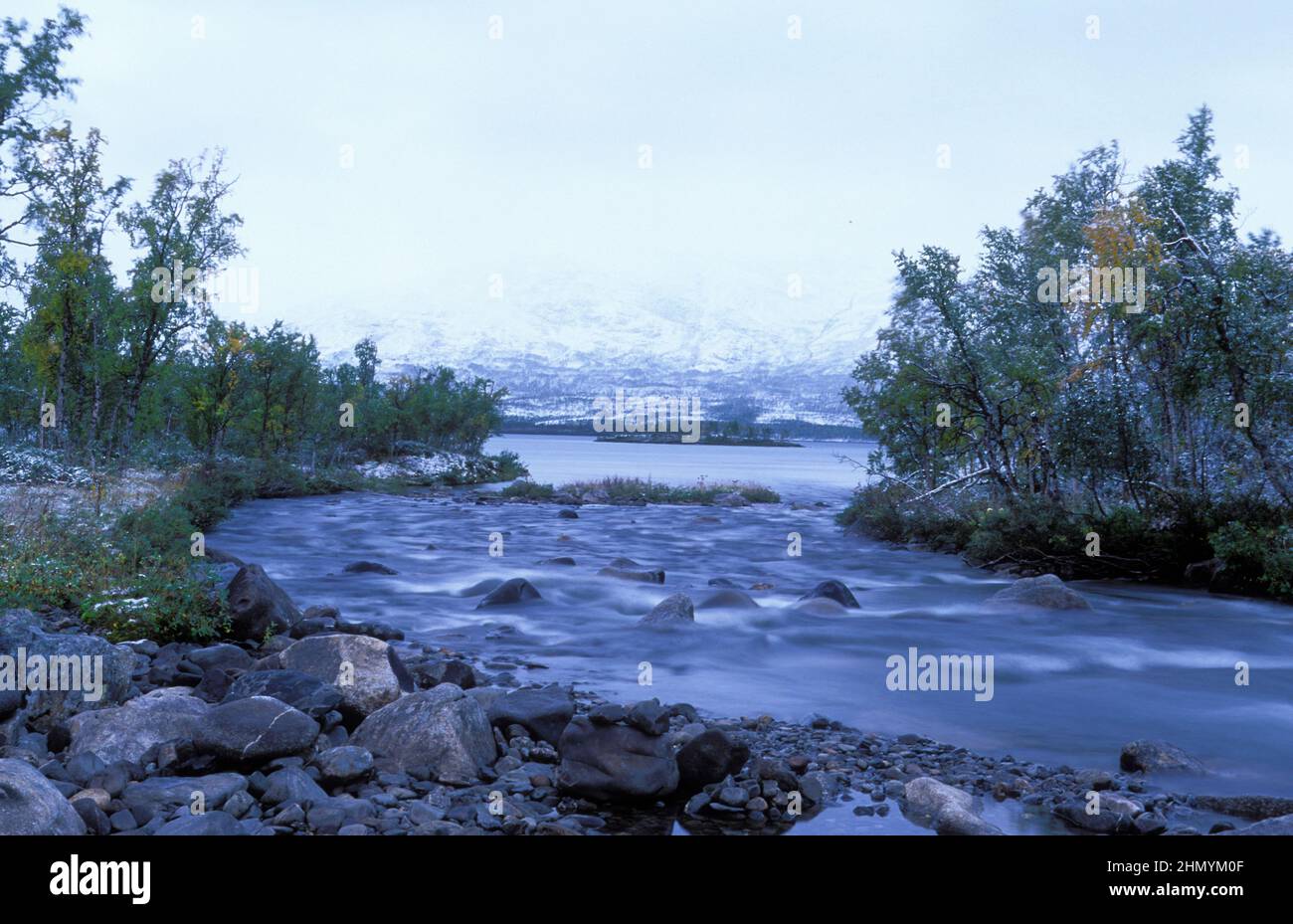 Creek, brook in the mountain during first snow in 2004, analog. Water ...