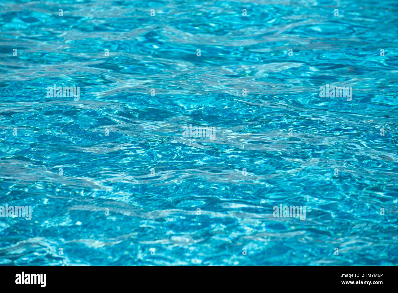 Water in swimming pool, background with high resolution. Wave abstract or rippled water texture ...