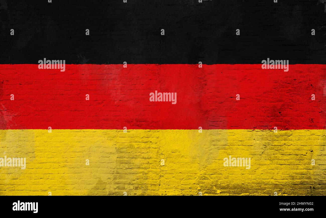 Full frame photo of a weathered flag of Germany painted on a plastered ...