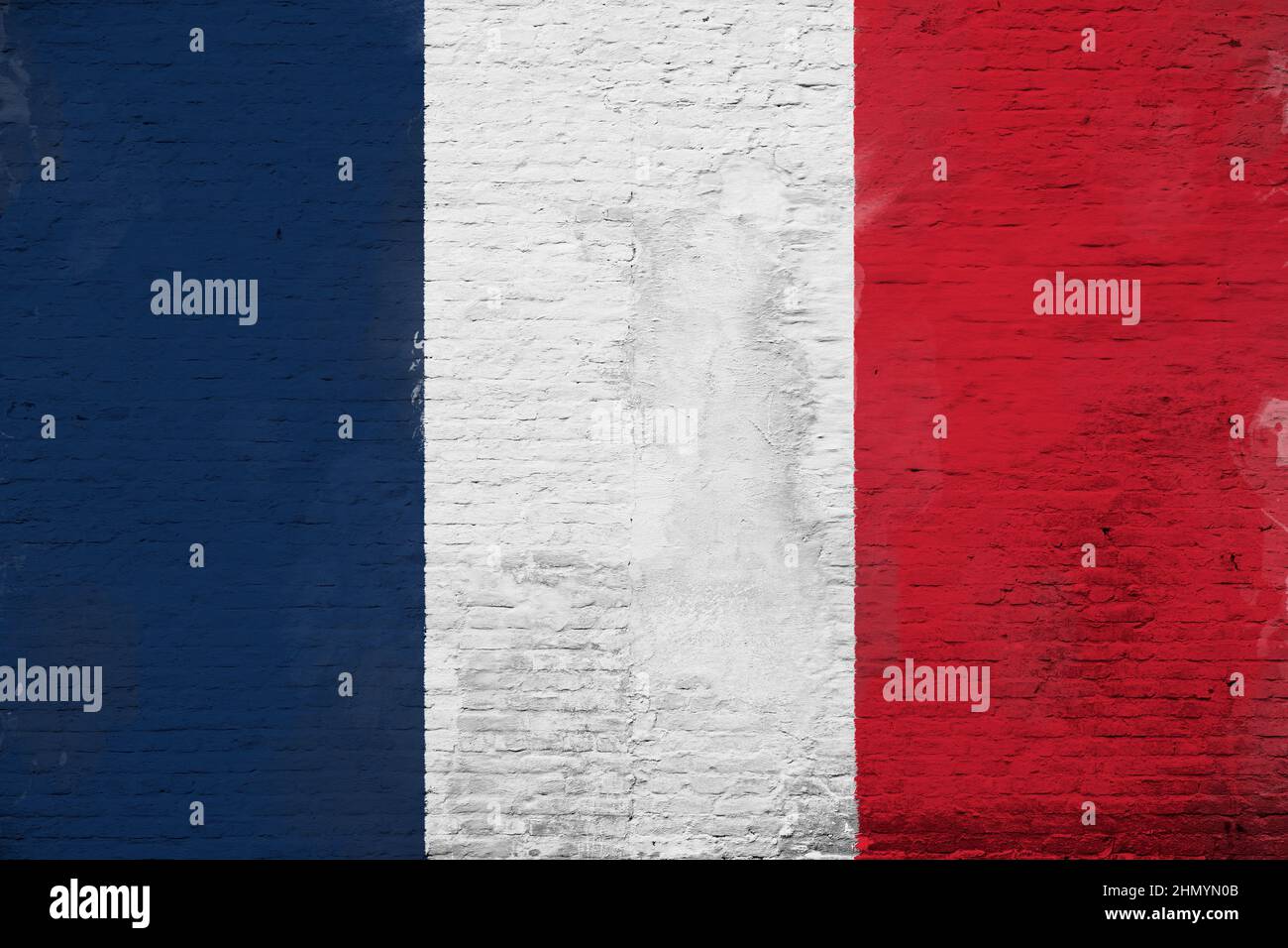 Full frame photo of a weathered flag of France painted on a plastered ...