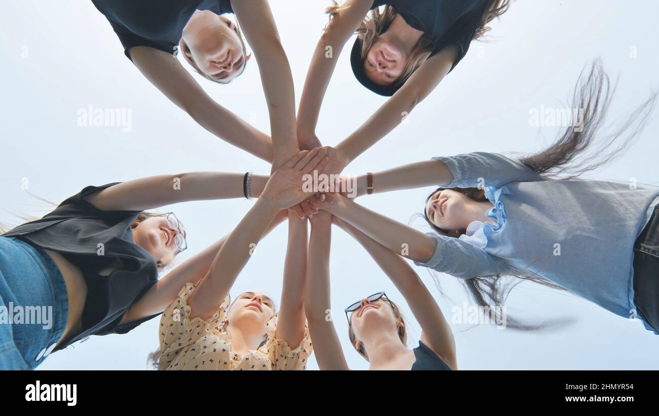 Group of female hands together in the park Stock Photo - Alamy