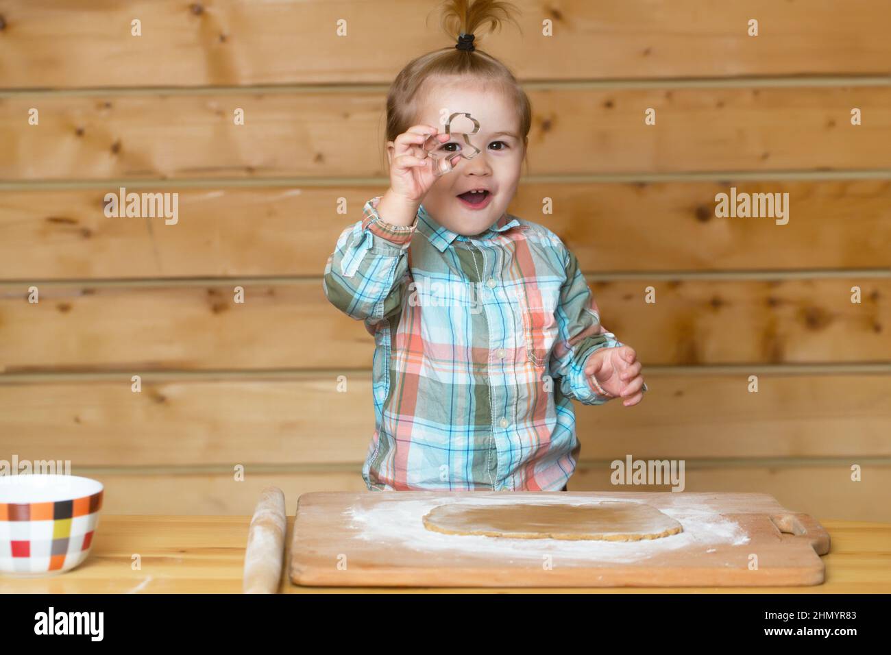 Little baker chef kid at kitchen. Gappy baby child baking cookies ...