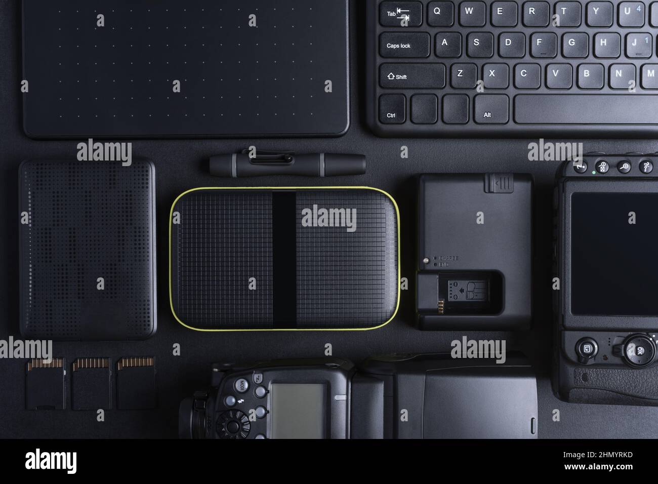 Top view of photographer work space with digital camera, flash, memory ...