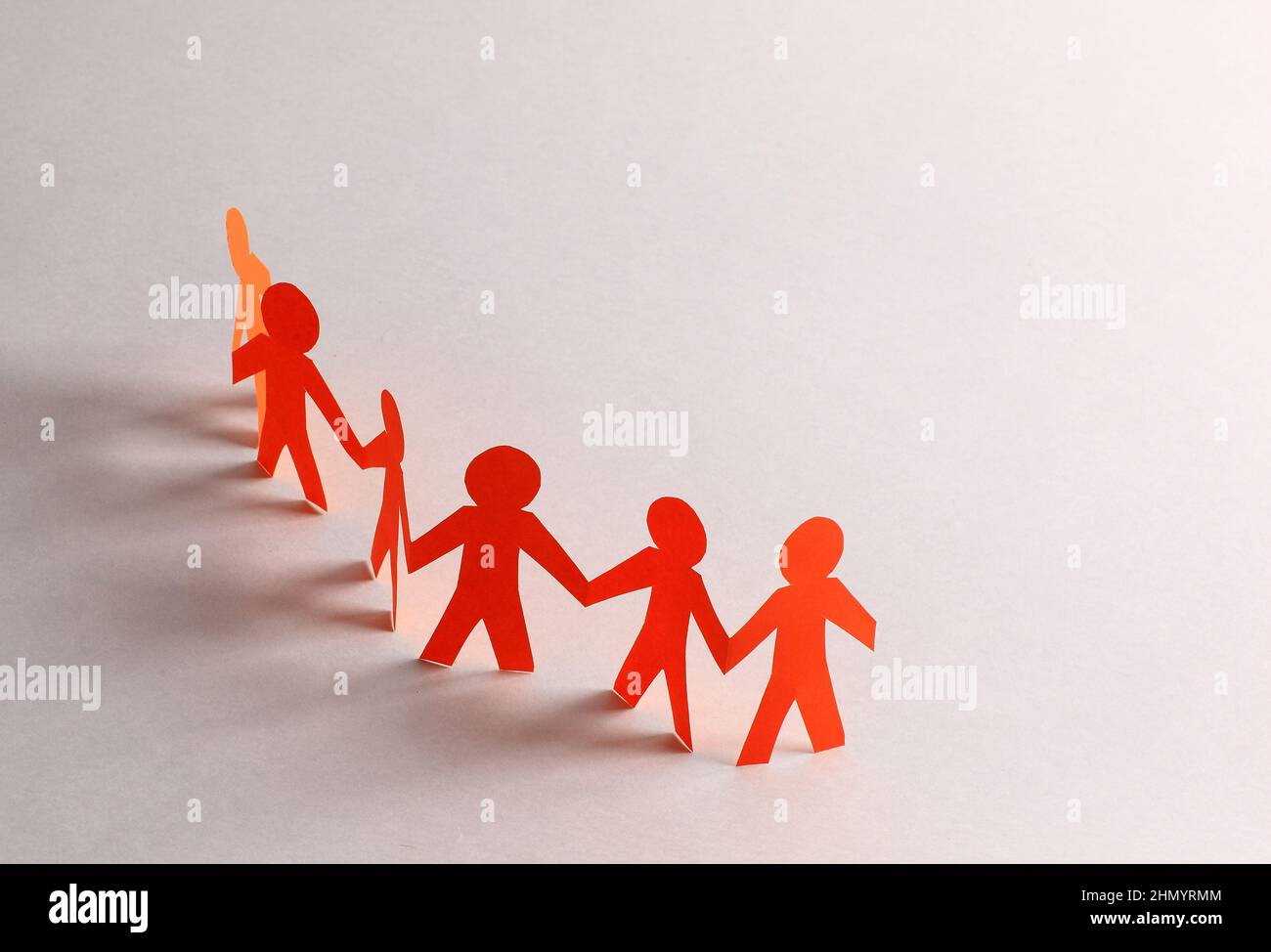 Paper people doing teamwork in their business Stock Photo - Alamy