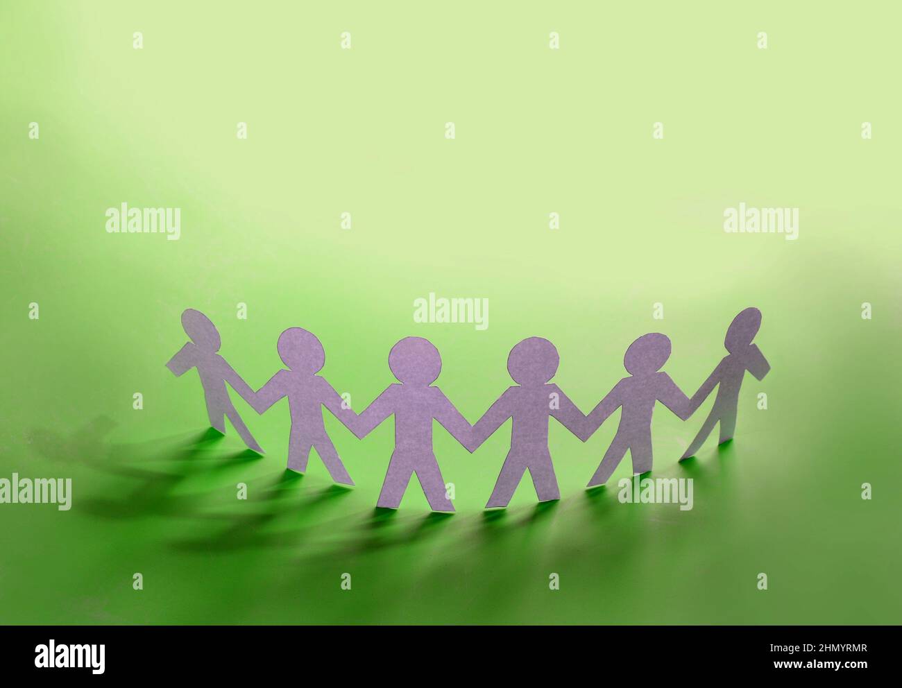 Paper people doing teamwork in their business Stock Photo - Alamy