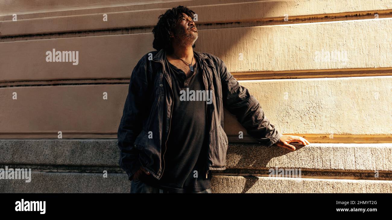 Homeless person standing hi-res stock photography and images - Alamy