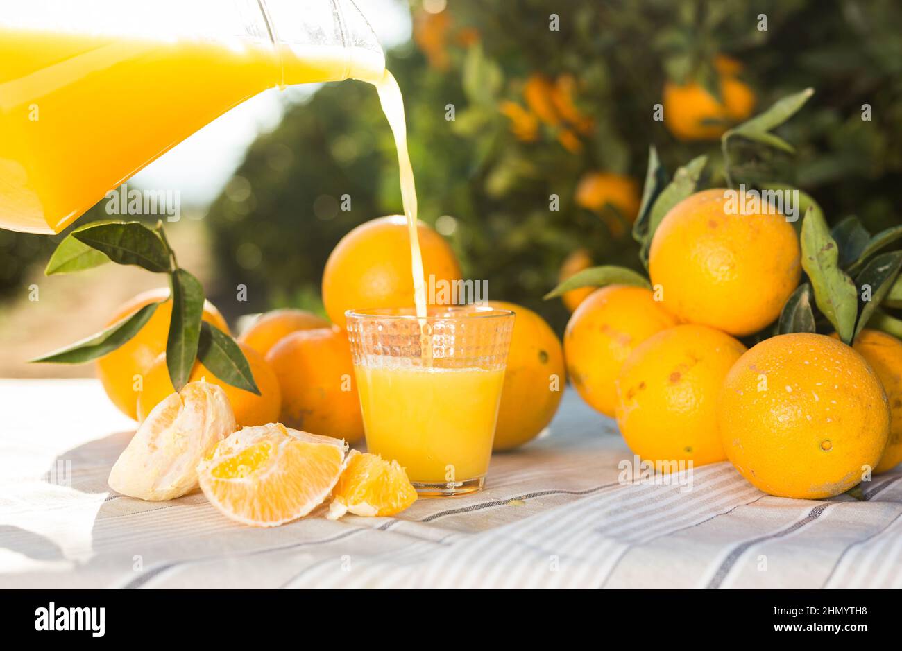 Orange juice pouring from jug hi-res stock photography and images - Alamy