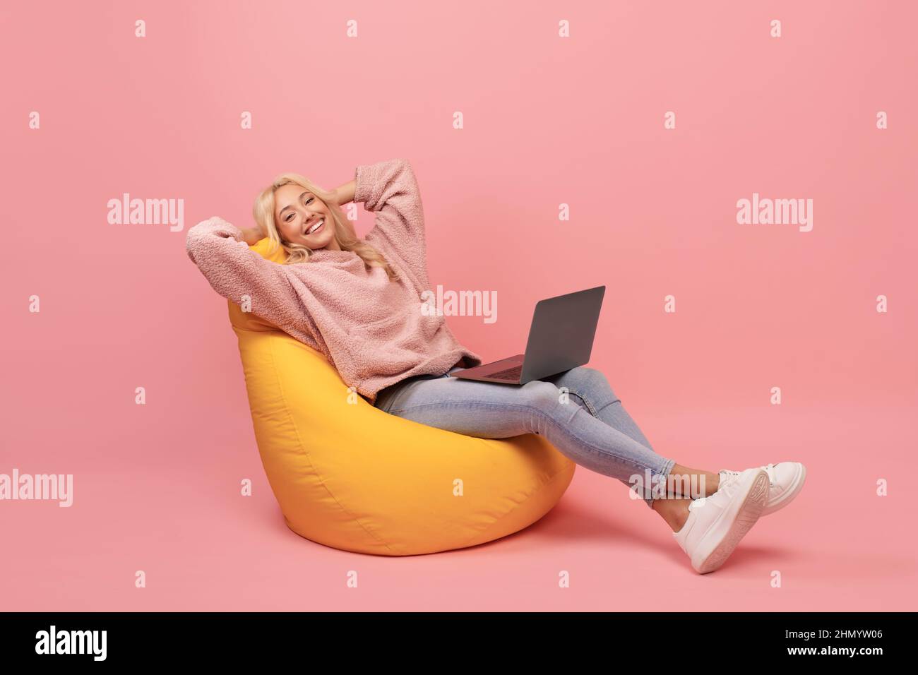 Person leaning back on chair hi-res stock photography and images - Alamy