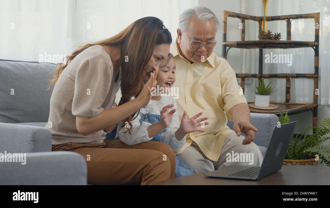 Happy family senior grandfather, daughter and granddaughter talking ...