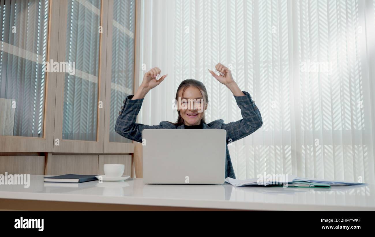 Happy business woman excited surprised work at white office desk with ...