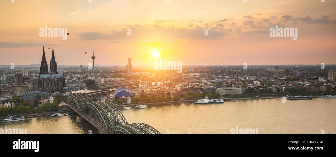 Cologne skyline at sunset with hot air balloons Stock Photo - Alamy