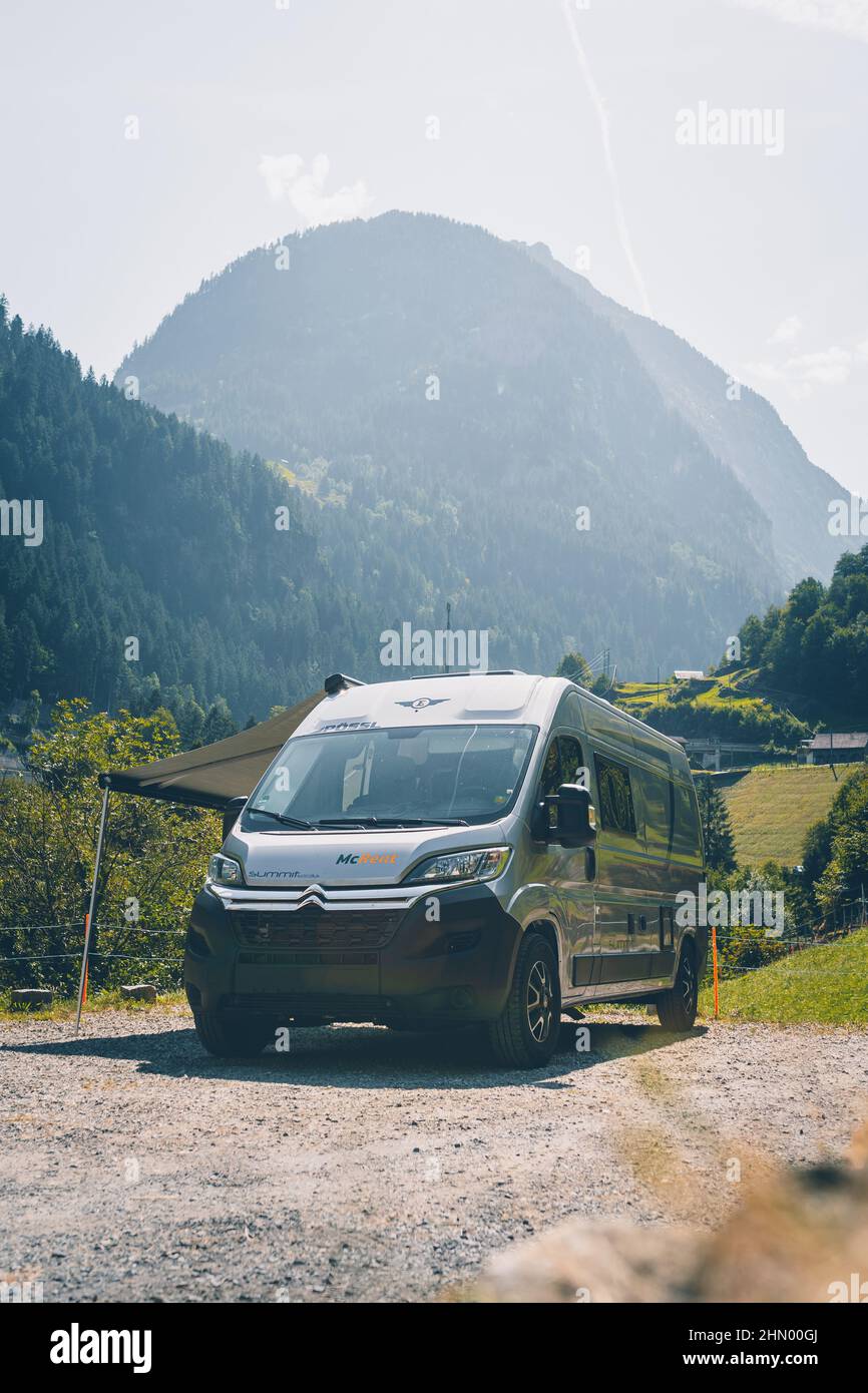 Vertical shot of the McRent camper van in front of the alps in ...