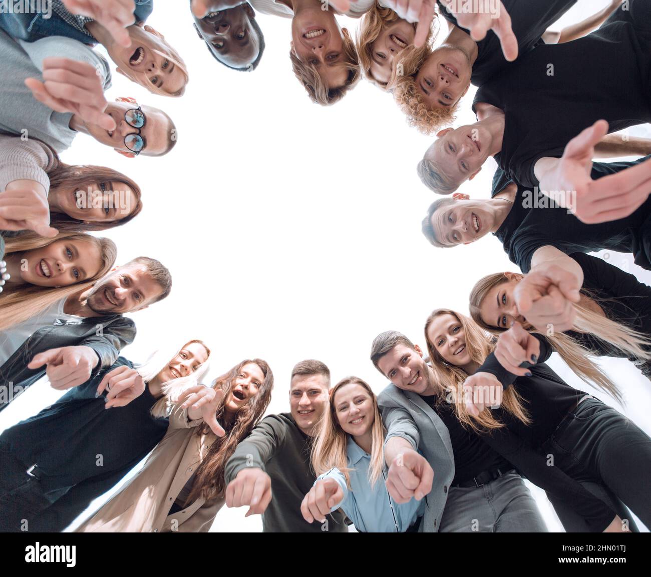 successful young people standing in a circle and pointing at you Stock ...