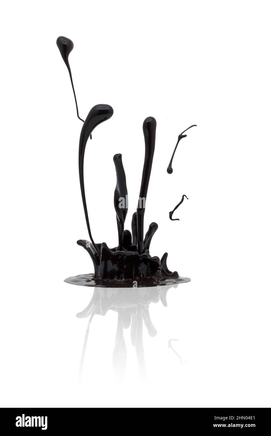 black oil splashing on white Stock Photo - Alamy