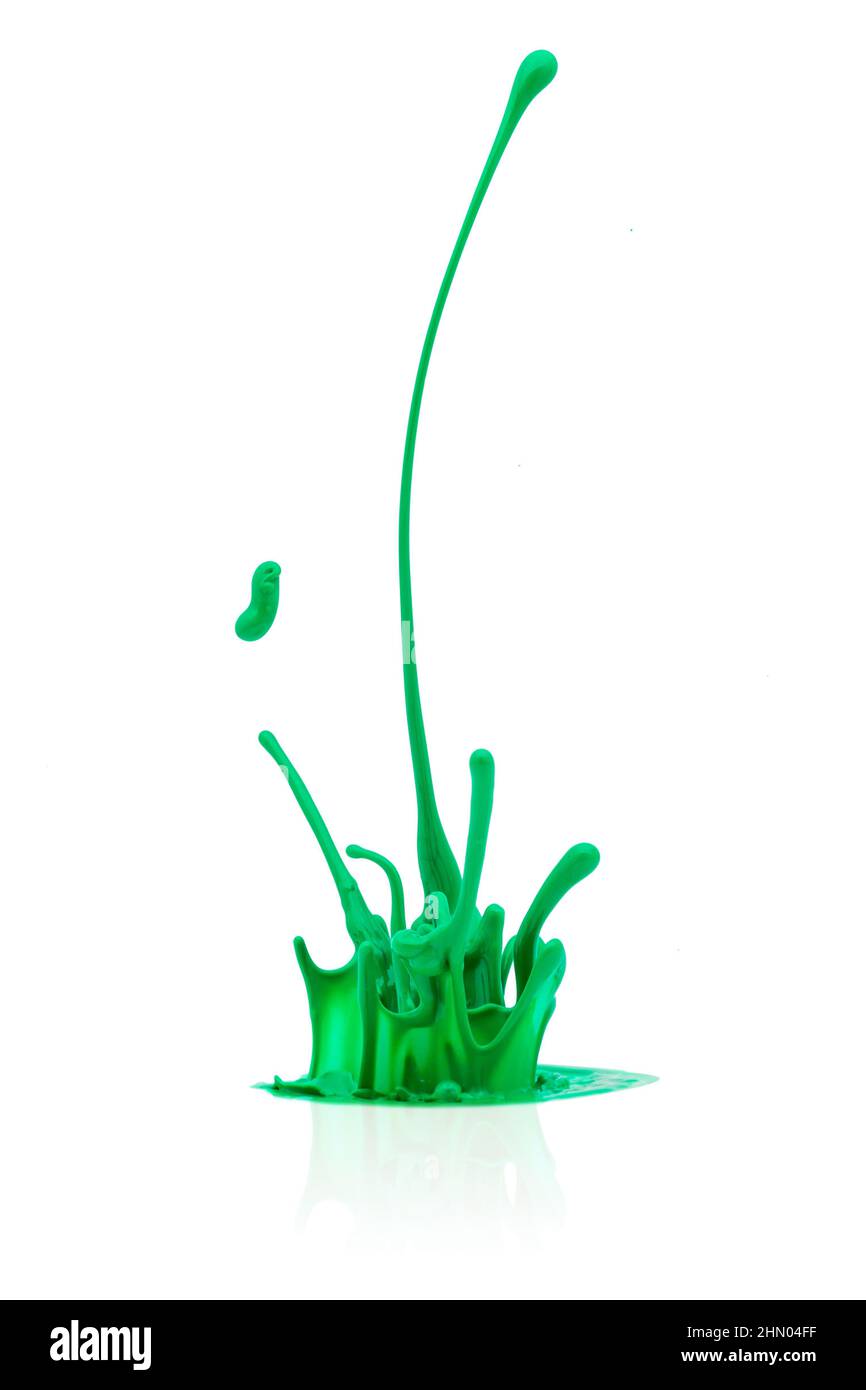 green paint splashing isolated on white Stock Photo - Alamy