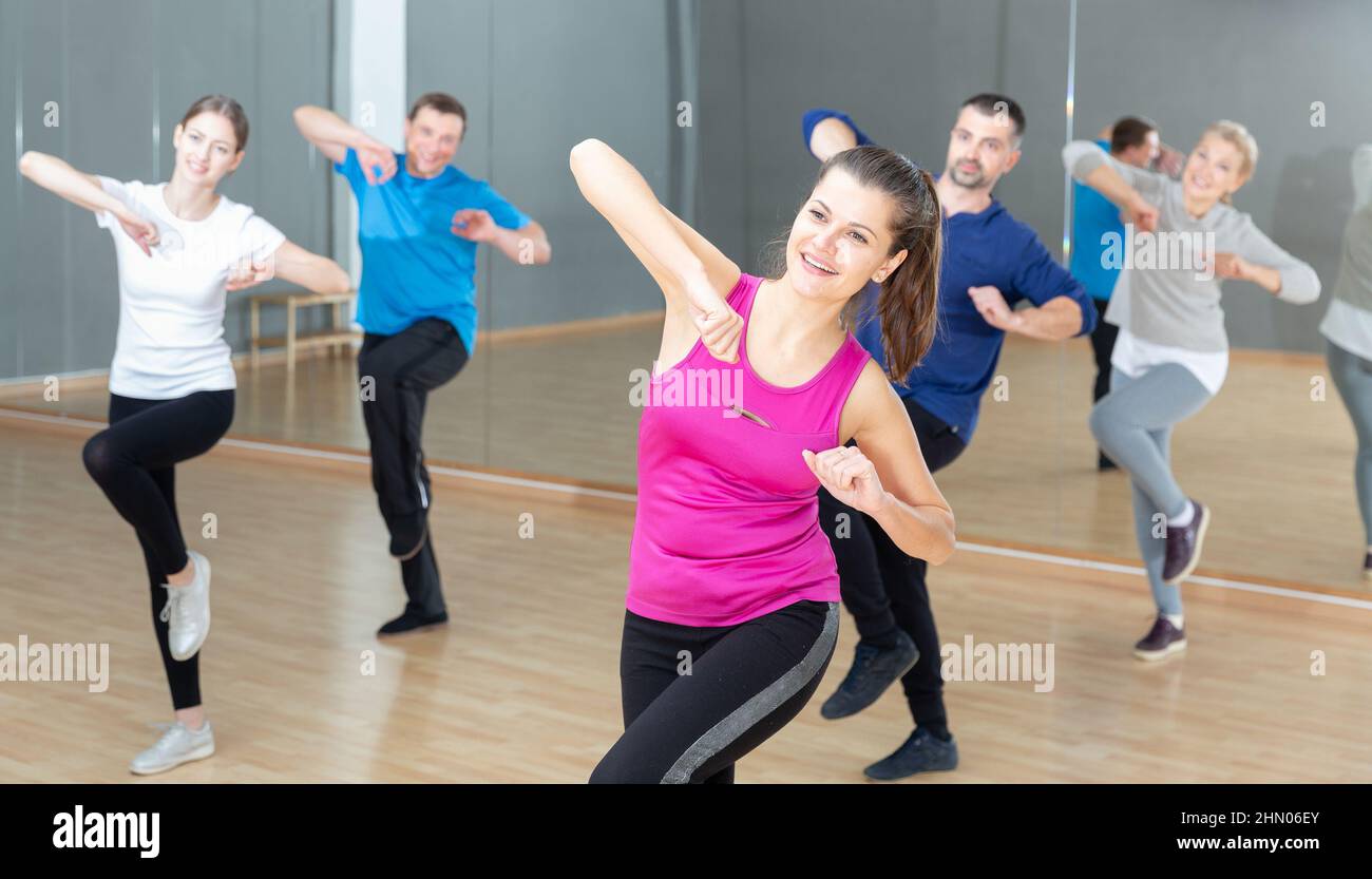 Woman training at group dance class Stock Photo - Alamy