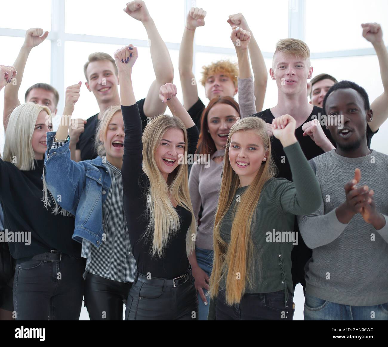 close up. group of smiling young people showing their success Stock ...