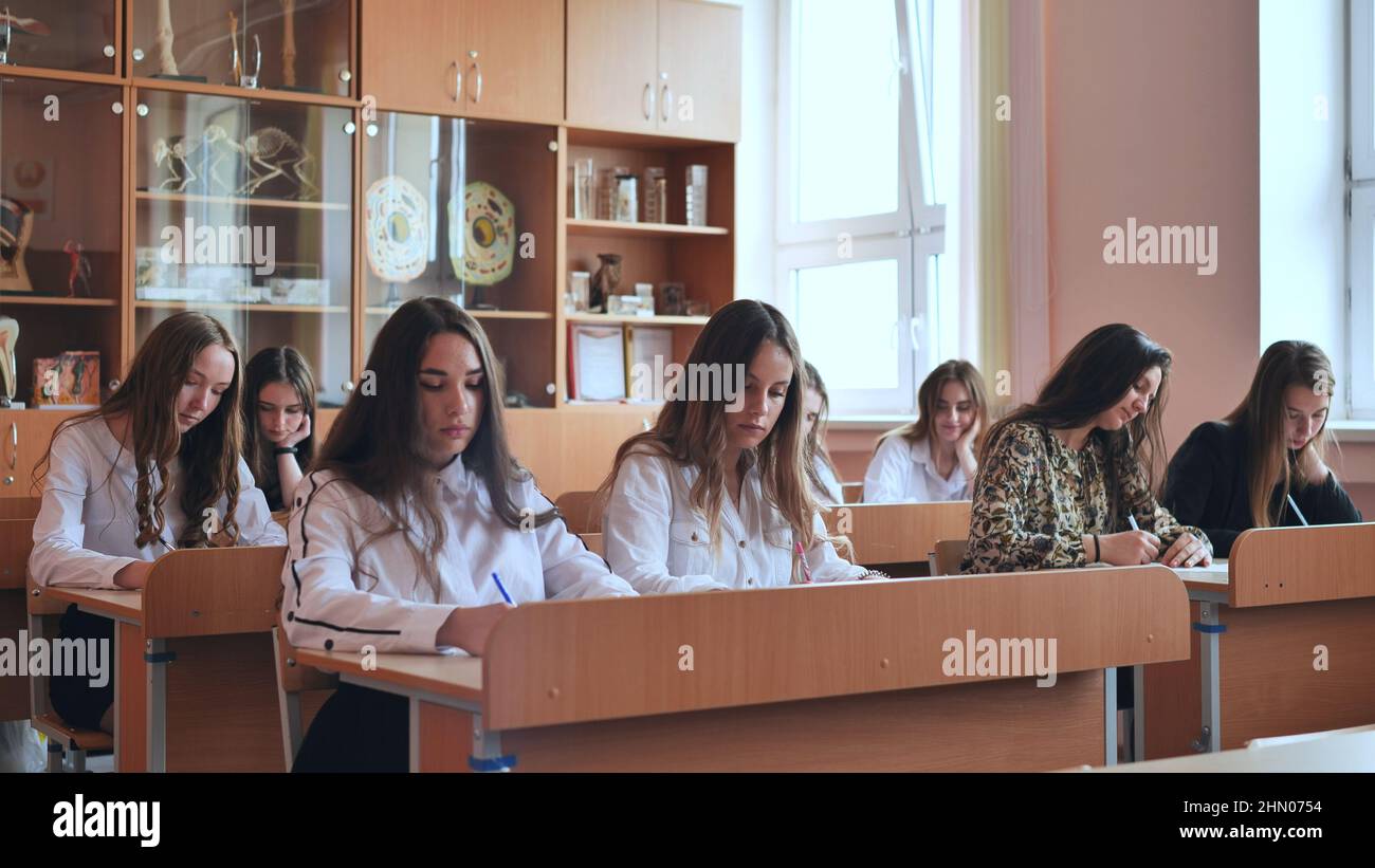 High school students sit at their desks during lessons Stock Photo - Alamy