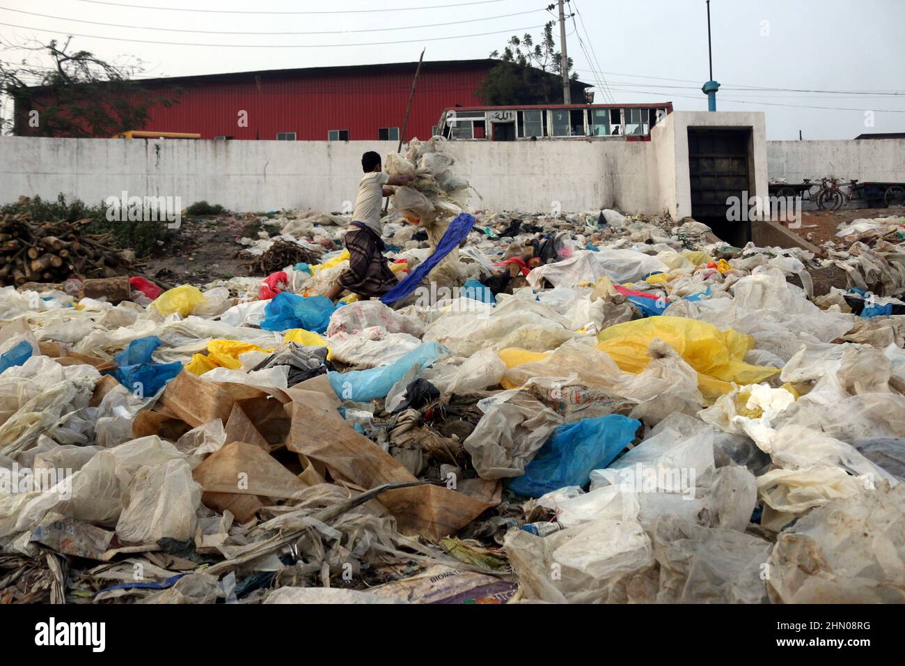 FEBRUARY 11,2022,DHAKA,BANGLADESH- Man is seen checking wasted ...
