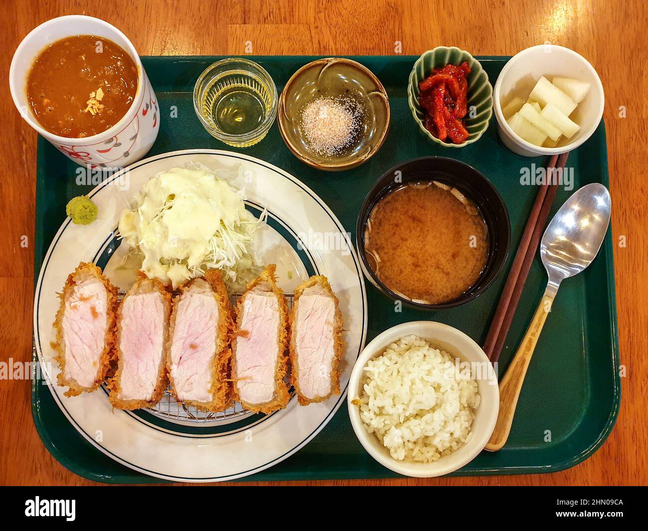 Tonkatsu, a Japanese breaded, deep-fried pork cutlet. Served with ...